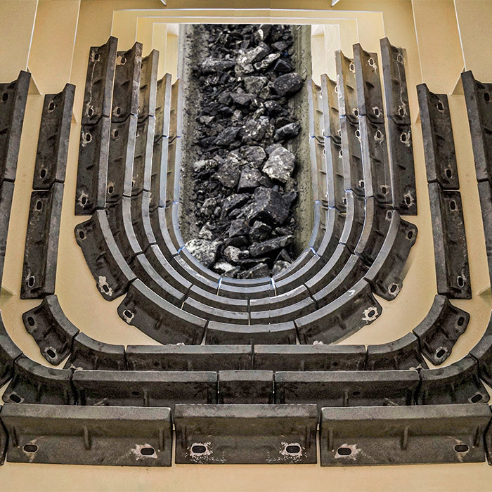 Wear lining for conveyor transfer chutes - Metso